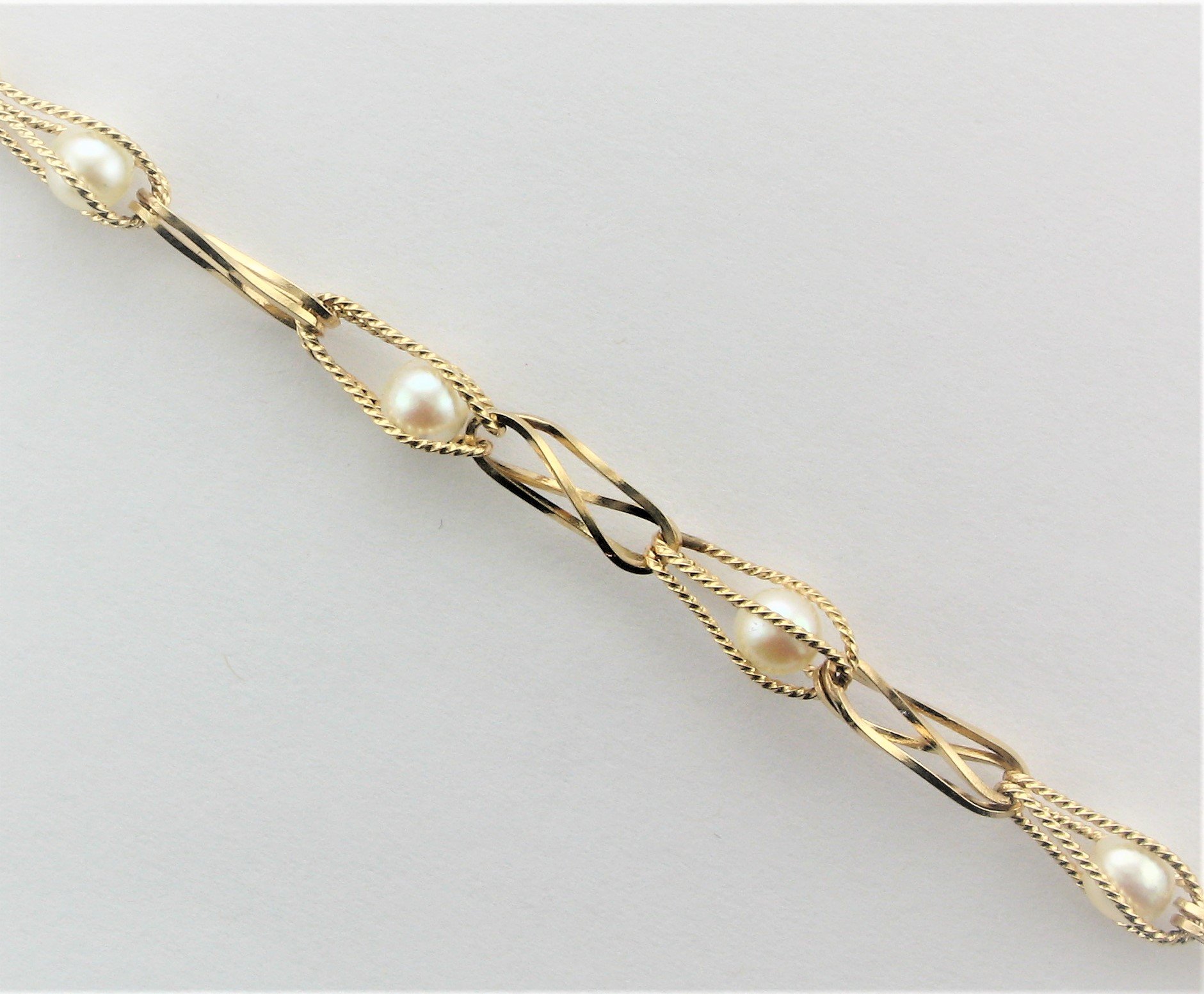 7 Bracelet with Beaded Pearl Cages Set in 14 Karat Yellow Gold.